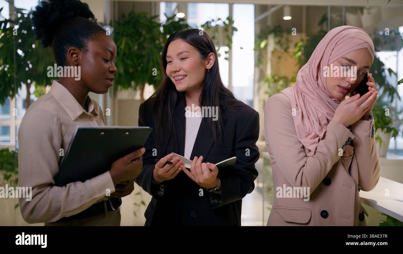 Diverse multiethnic girls three women female teamwork at office African ...