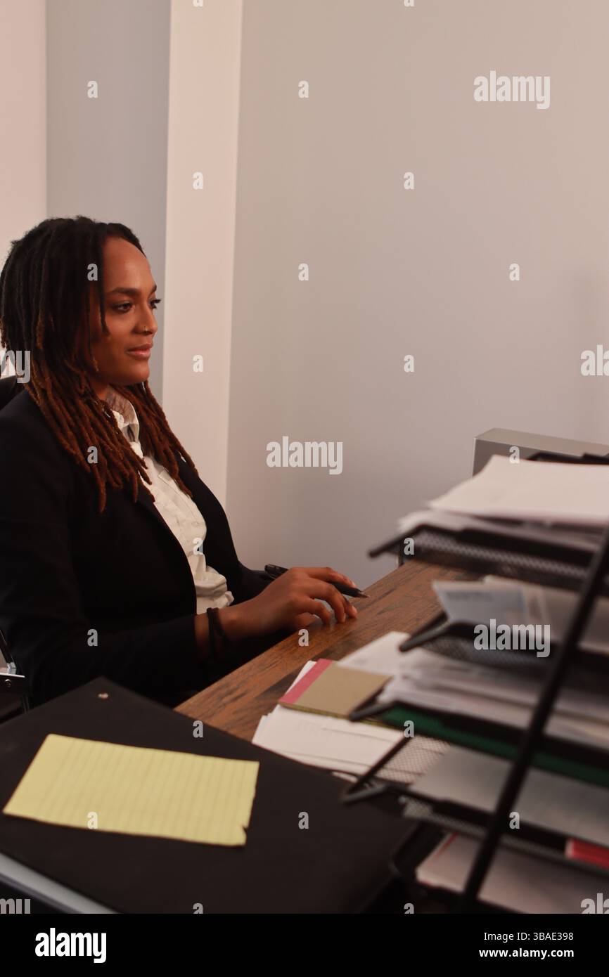 Black Afro-Caribbean woman with natural dreadlocks dressed in modern ...