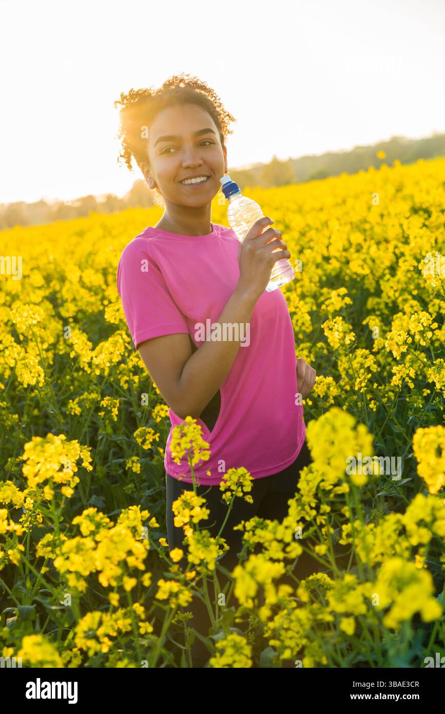 Outdoor portrait of beautiful happy mixed race African American girl ...
