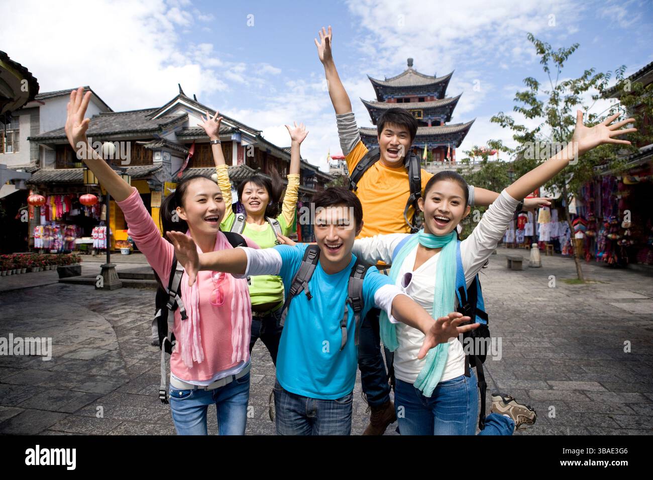 Excited young Chinese friends in the street of Dali Stock Photo - Alamy