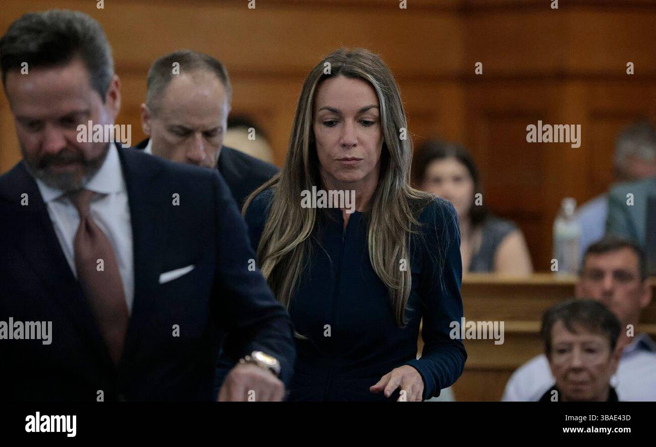 With her defense attorneys Alan Jackson, left, and David Yannetti ...
