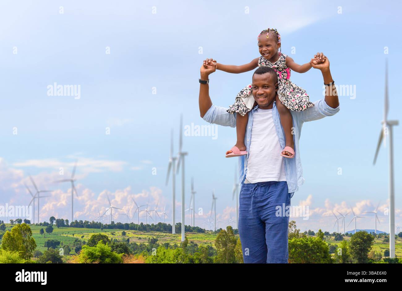 Cheerful African American father and daughter, Father carrying daughter on shoulders, Little ...