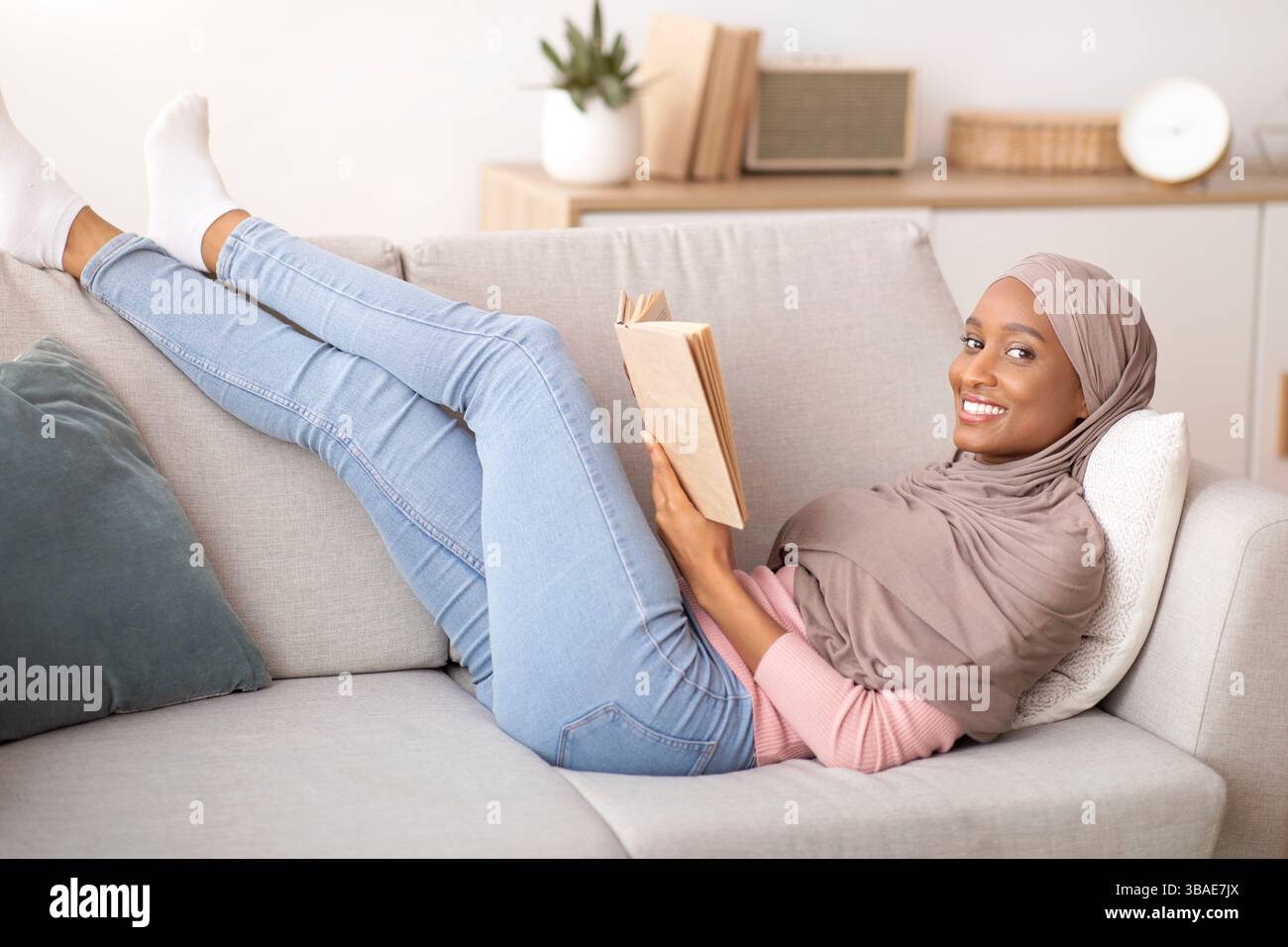 Weekend stay home pastimes concept. Lovely African American woman in ...