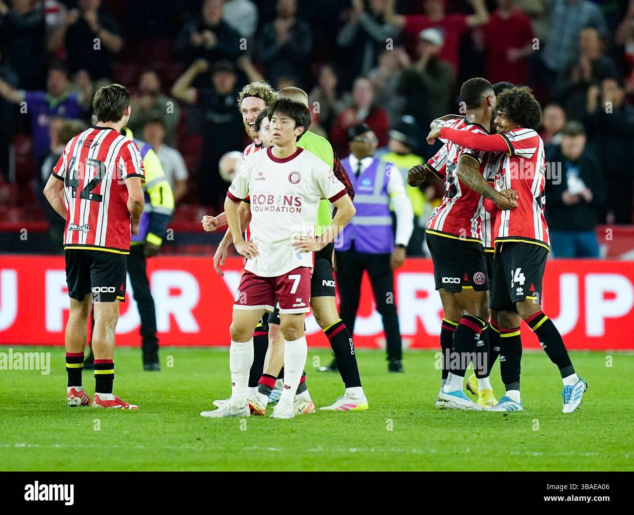 Bristol City's Yu Hirakawa stand dejected as Sheffield United players ...