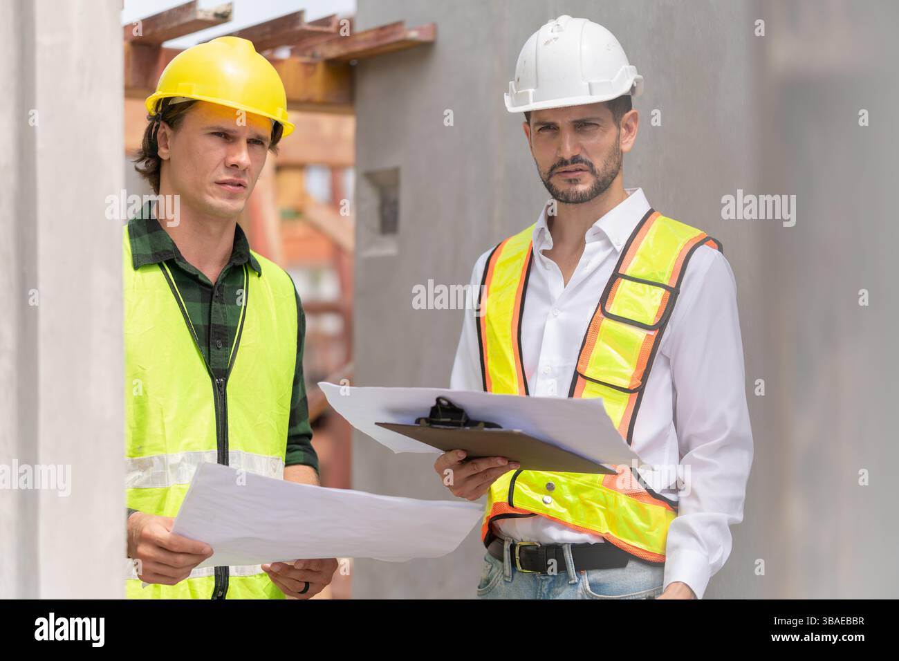 Foreman and workers team meeting for planning project at precast ...