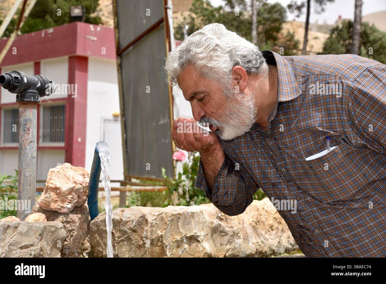 Damascus, Syria. 12th May, 2025. A man drinks from the reserve well of ...