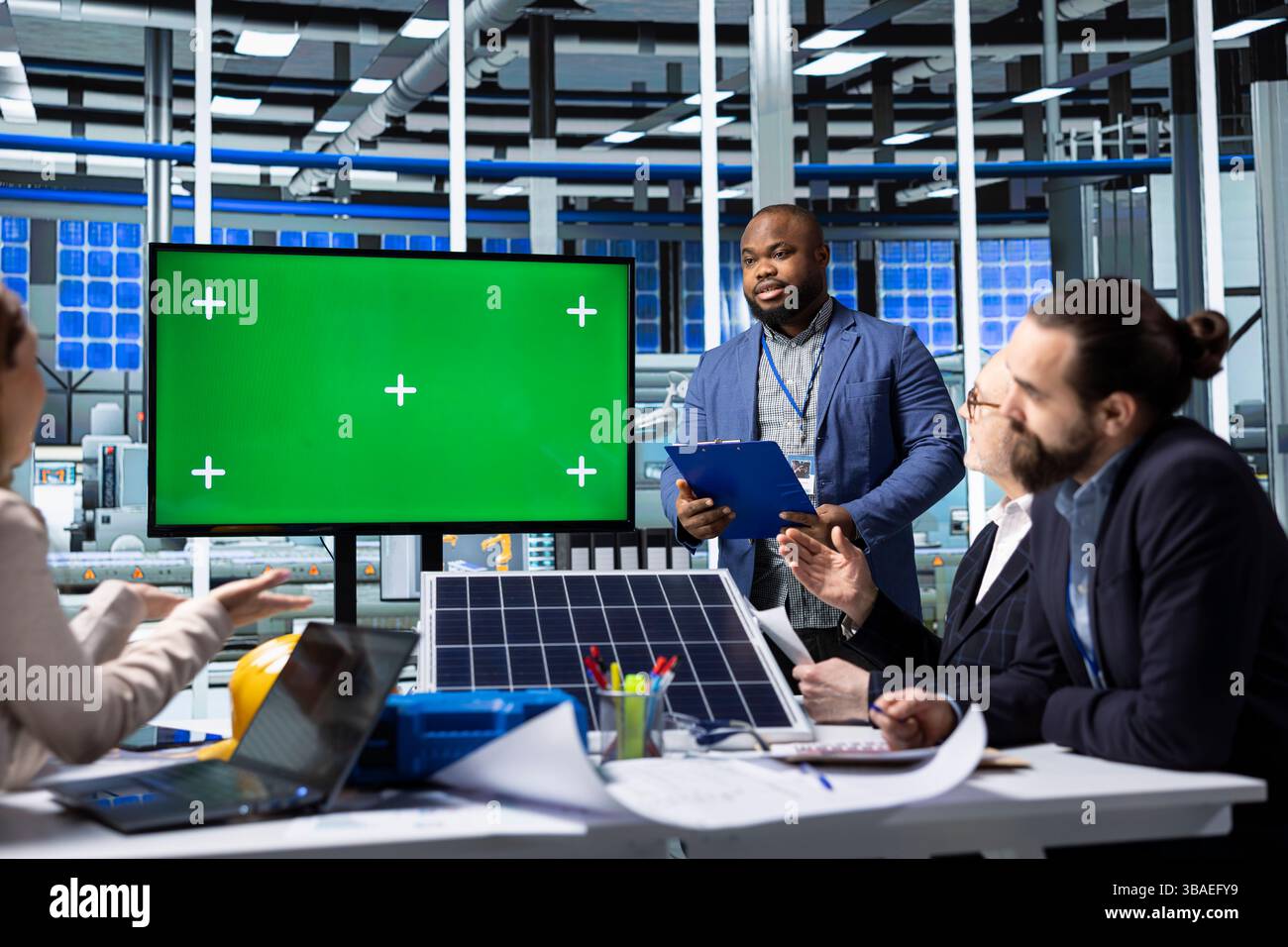 Businessmen using mockup display to show solar panels designs research ...