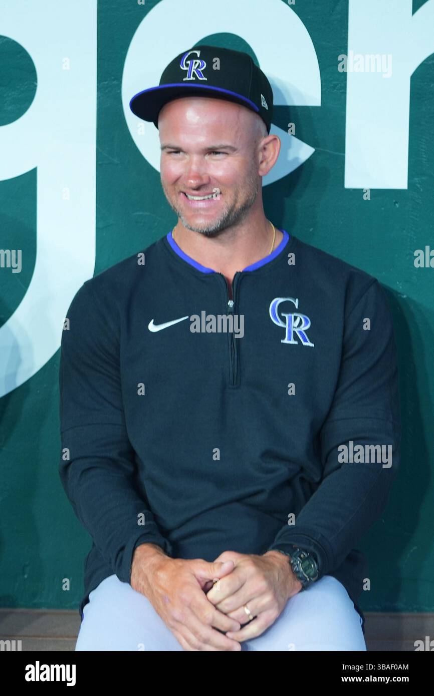 Colorado Rockies interim manager Warren Schaeffer sits in the dugout ...