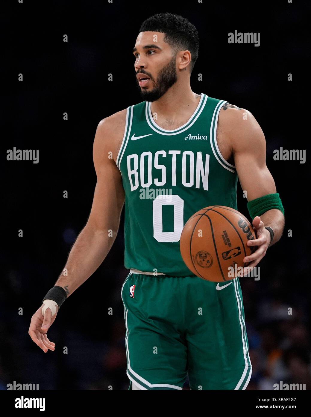 Boston Celtics' Jayson Tatum dribbles the ball during the second half ...