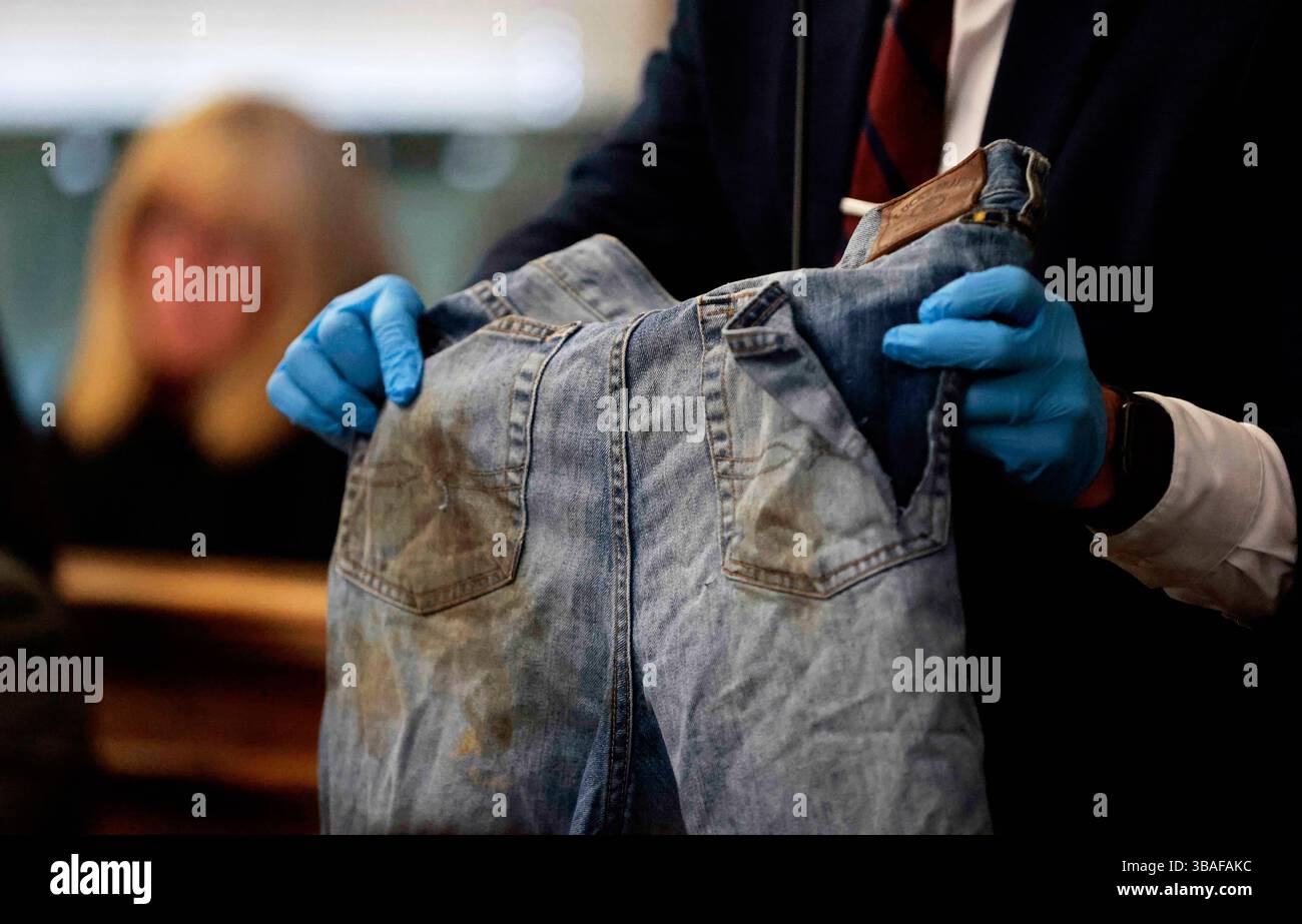 Sgt. Yuriy Bukhenik, of the Massachusetts State Police, holds the ...