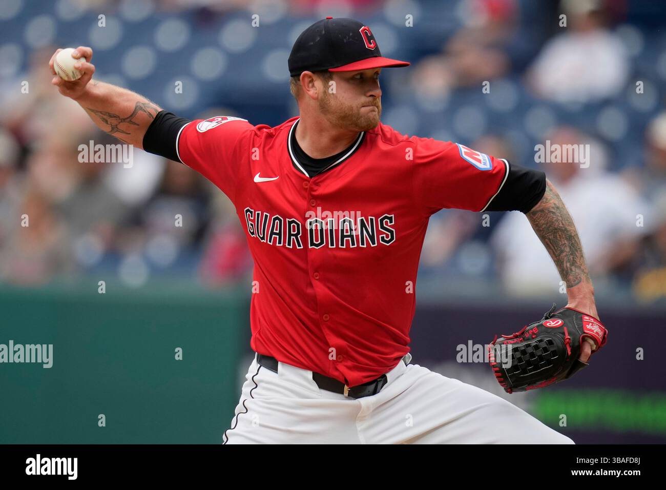 Cleveland Guardians' Ben Lively pitches in the first inning of a ...