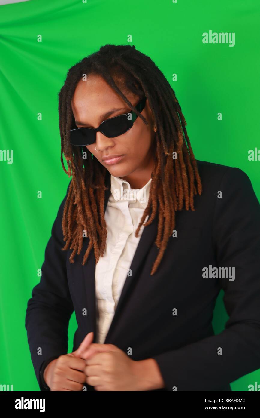 Black woman of Afro-Caribbean descent with dreadlocks and sunglasses ...