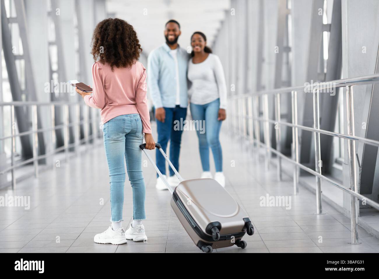 Meeting In Airport Concept. Parents waiting their daughter, rear back ...