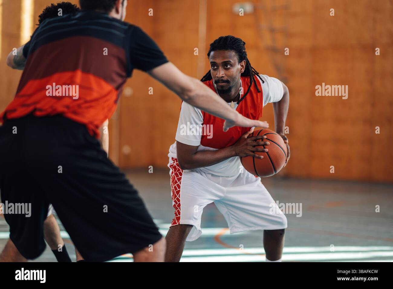 Portrait of an middle eastern man with dreadlocks playing basketball ...