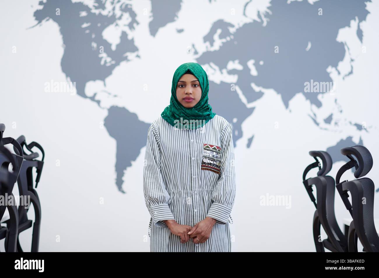 Portrait of muslim african female software developer with green hijab ...