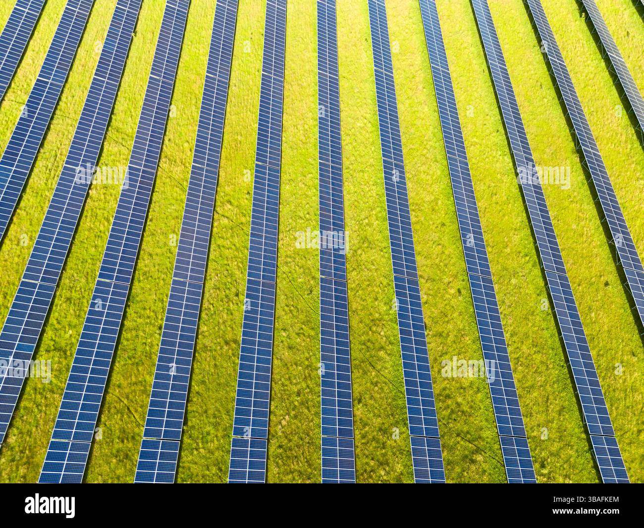 Photovoltaic Solar Panels in Green Field. Aerial View Stock Photo - Alamy