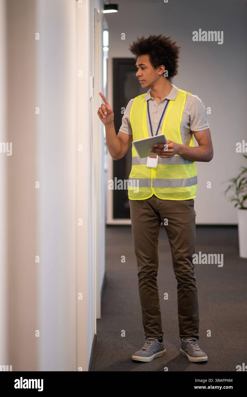 Door locker check. Service man checking the sensor door locker and ...
