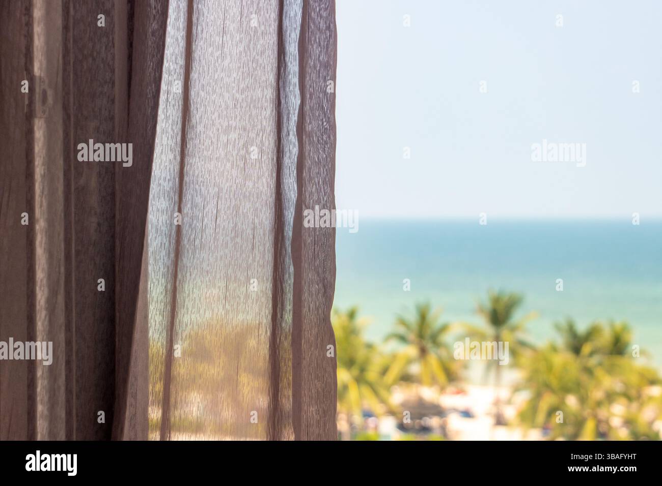 Tropical beach view through windows curtain in relaxing resort Stock ...