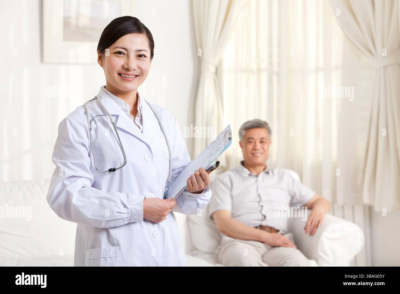 Chinese family doctor and Senior Chinese patient Stock Photo - Alamy