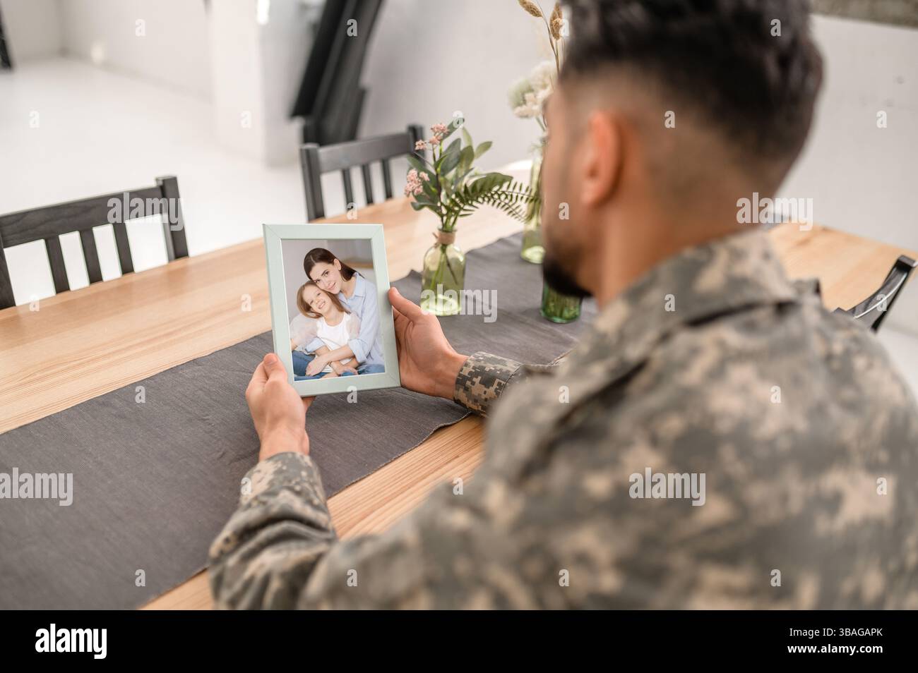 Arab military man with sad facial expression wearing camouflage uniform ...