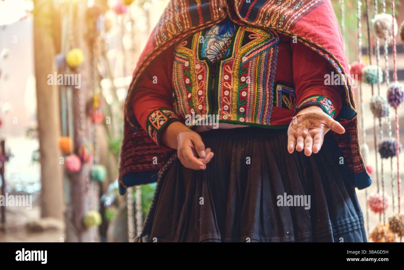 Traditional pigment material used by the incas, Andean woman working in ...