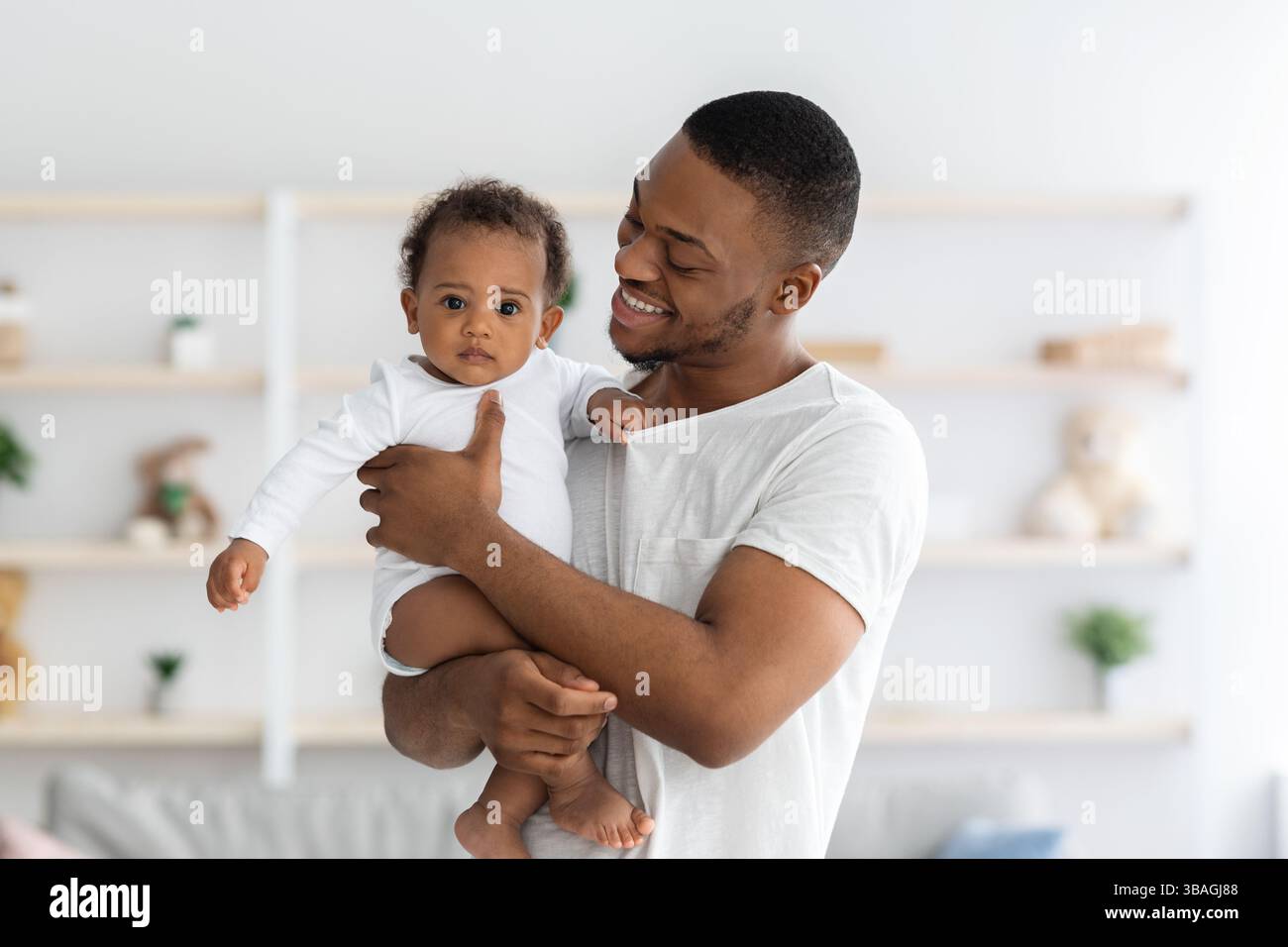 Happy Black Millennial Father Holding Adorable Infant Baby In Hands, Loving African American Dad ...