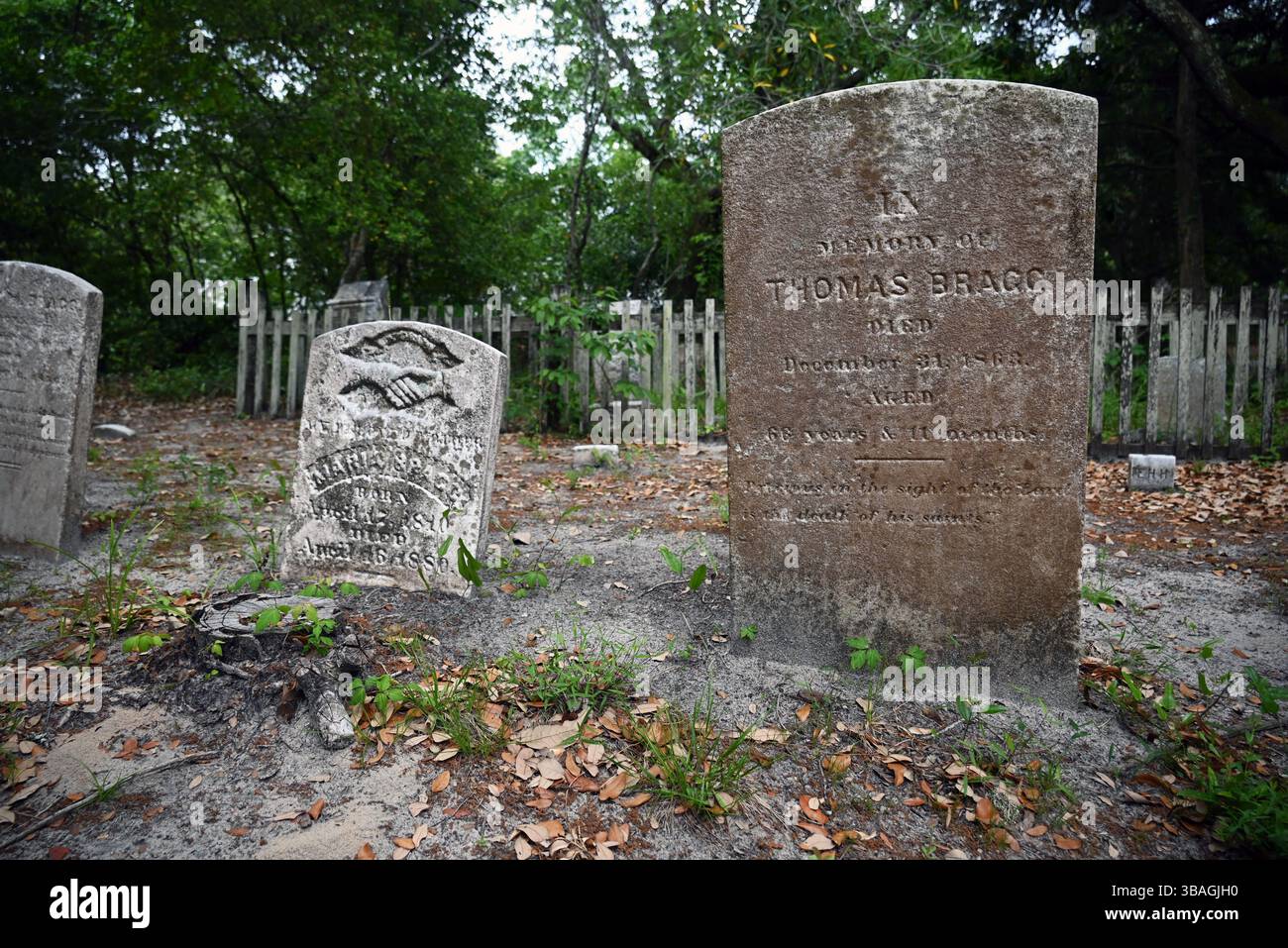 Old weathered headstones at a family cemetery on Howard Street in ...