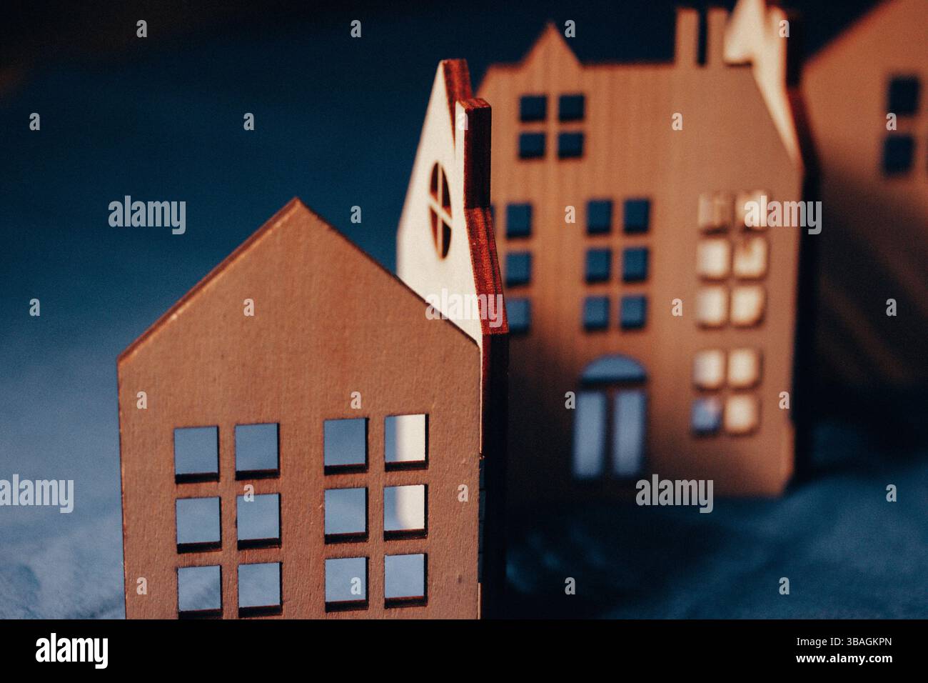 Miniature wooden houses, beautifully crafted and arranged in a row ...