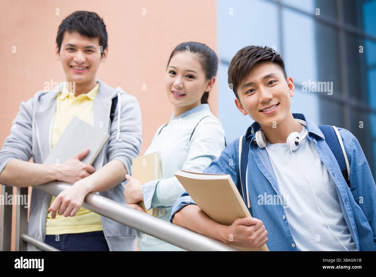 Happy Chinese college student outside library Stock Photo - Alamy