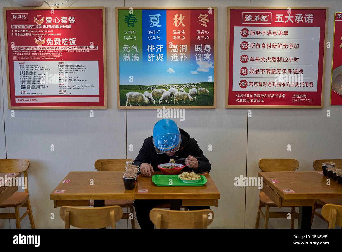 Liu Lijie, a food delivery rider from Ele.me eats his meal at Yushiji ...