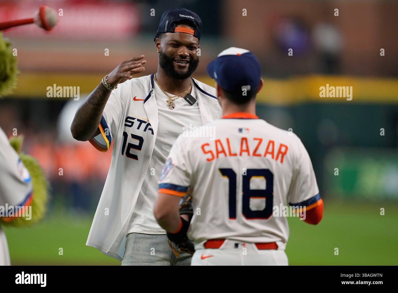 Houston Texans wide receiver Nico Collins, left, is greeted by Houston ...