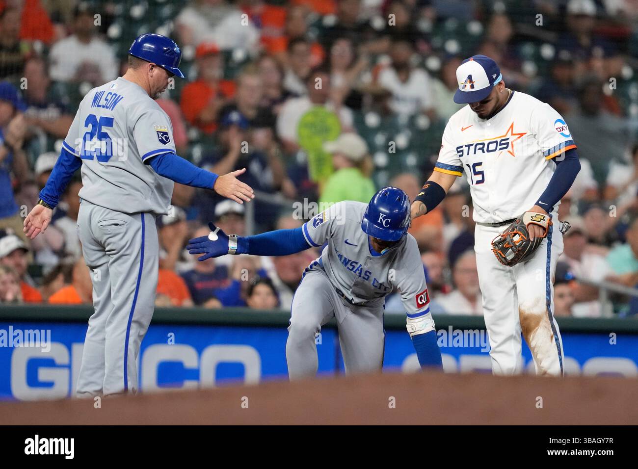 Kansas City Royals' Bobby Witt Jr., center, celebrates with third base ...