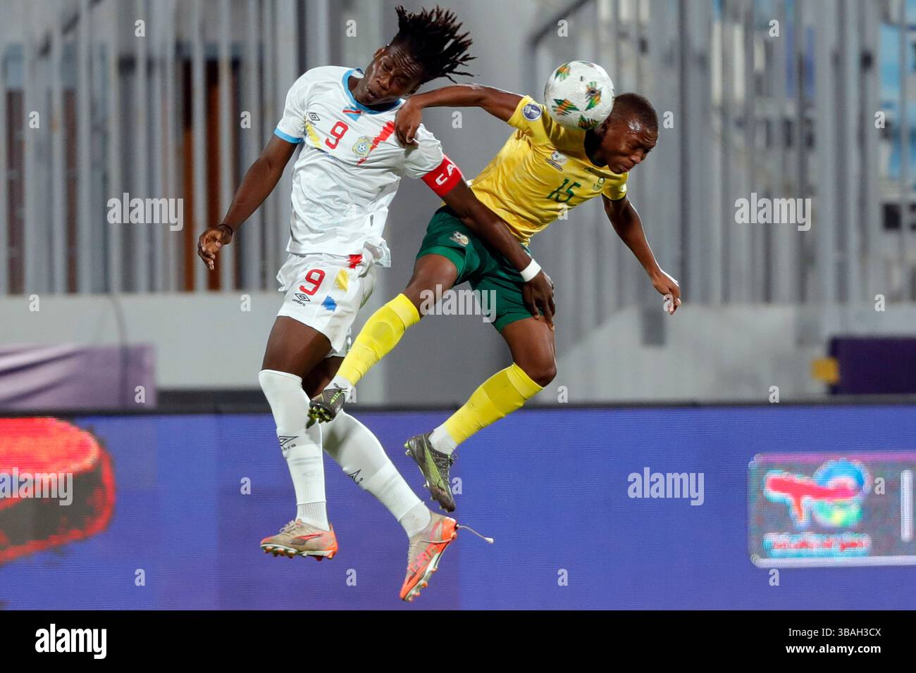 Ismailia, Egypt. 12th May, 2025. Lazola Maku (R) of South Africa vies with Samuel Ntanda-Lukisa ...