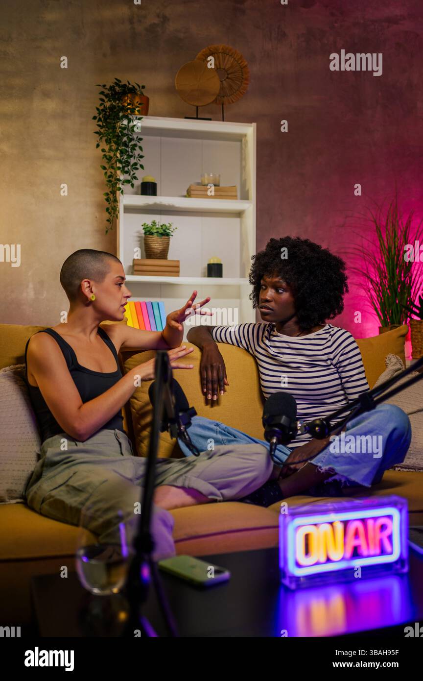 Portrait of a diverse female radio presenters having a interesting ...