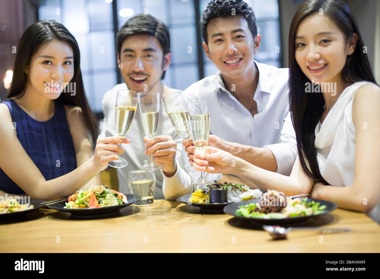 Chinese friends having dinner together Stock Photo - Alamy