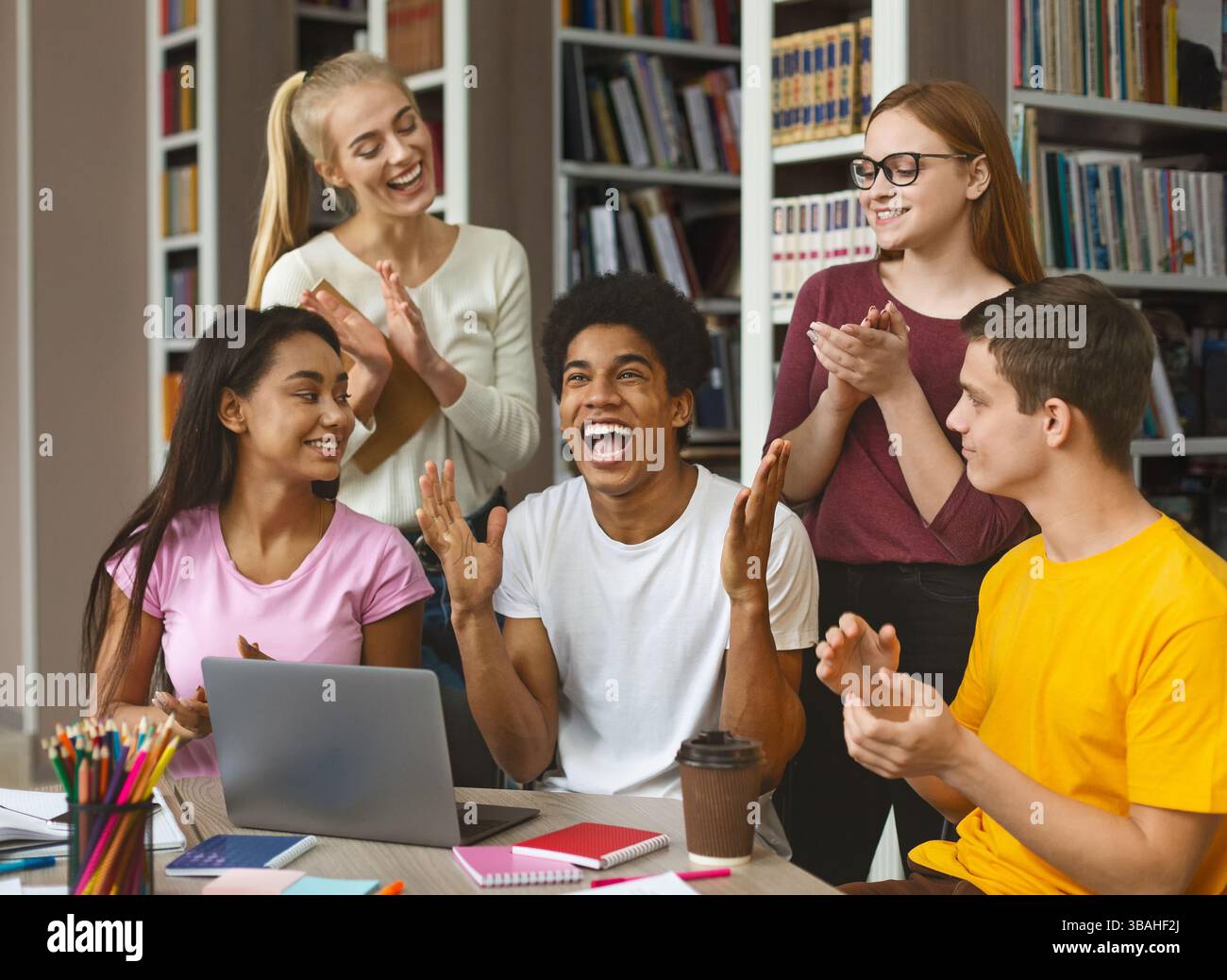 Exam is passed. Emotional afro male student expressing happines, his ...