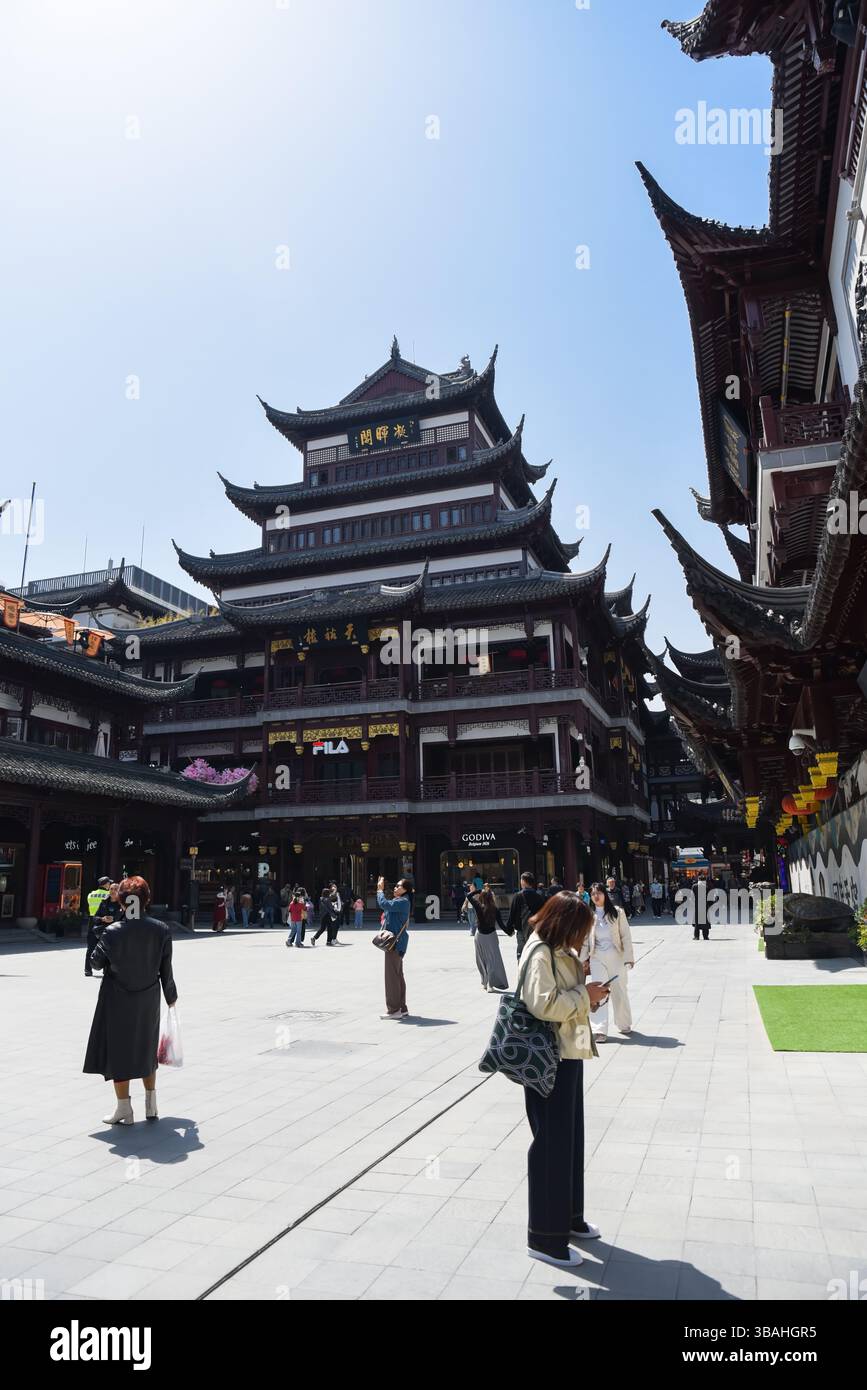 Shanghai, China - 1 April 2025: Tourists walk around the central plaza ...