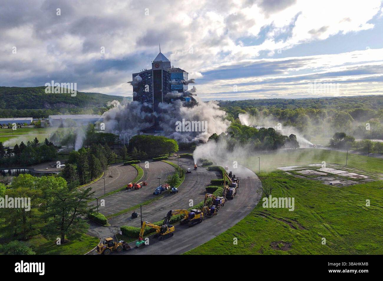 The former Sheraton Crossroads Hotel is demolished in a controlled ...