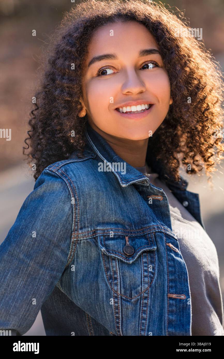 Outdoor portrait of beautiful happy mixed race African American girl ...