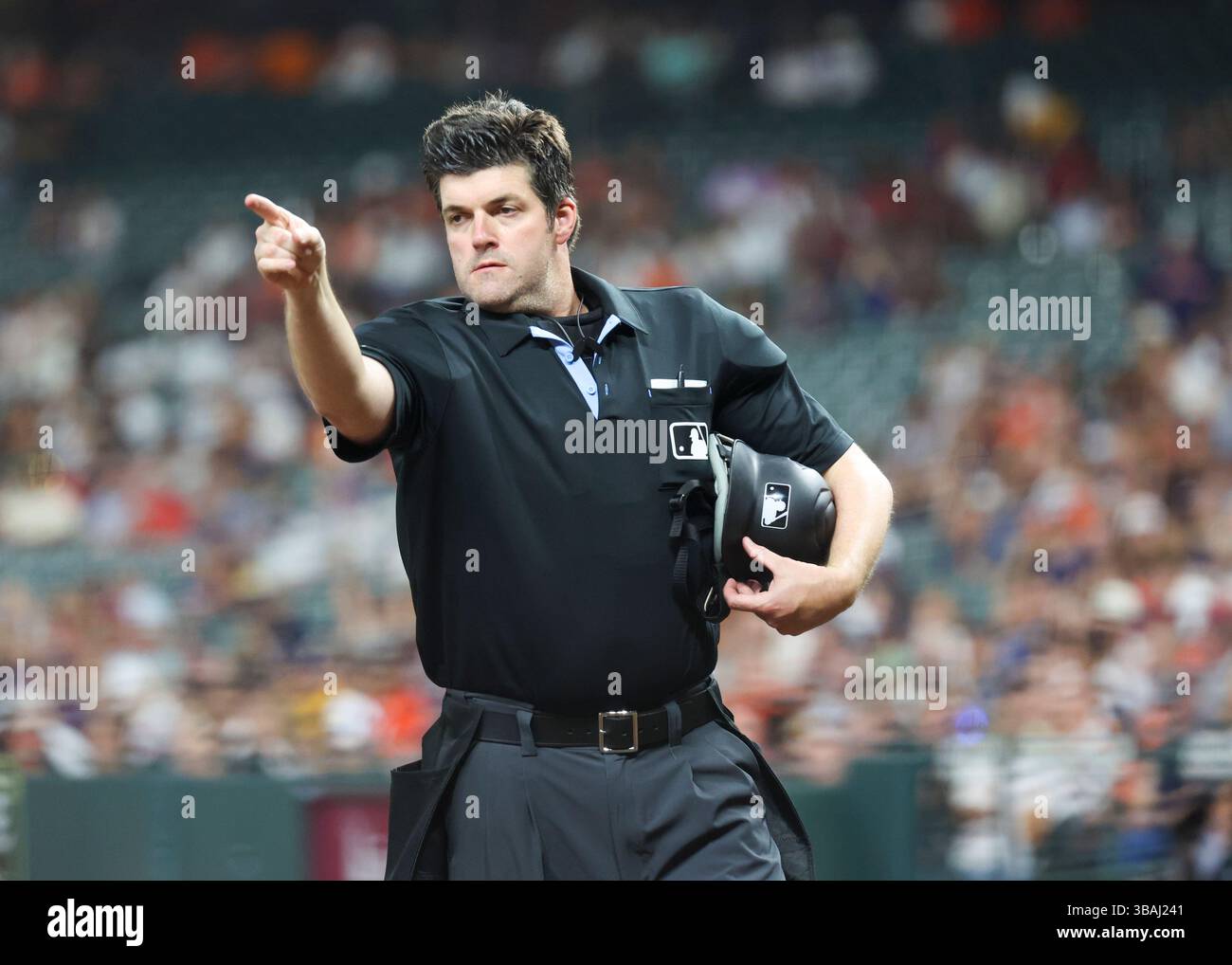 HOUSTON, TX - MAY 12: Head umpire John Bacon (70) points to the ...