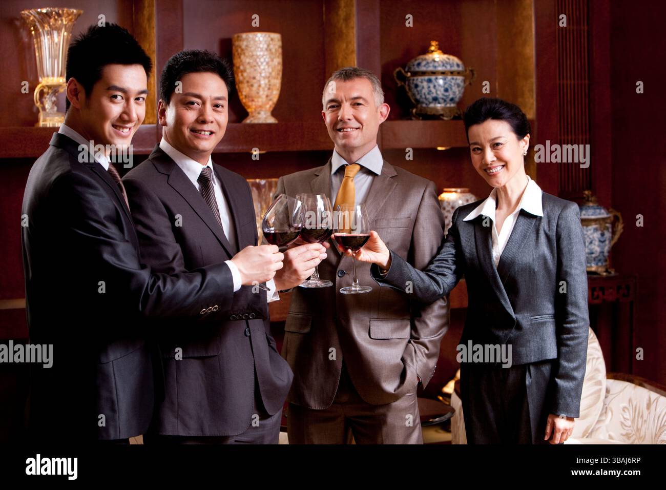 Chinese businessmen toast for celebration Stock Photo - Alamy