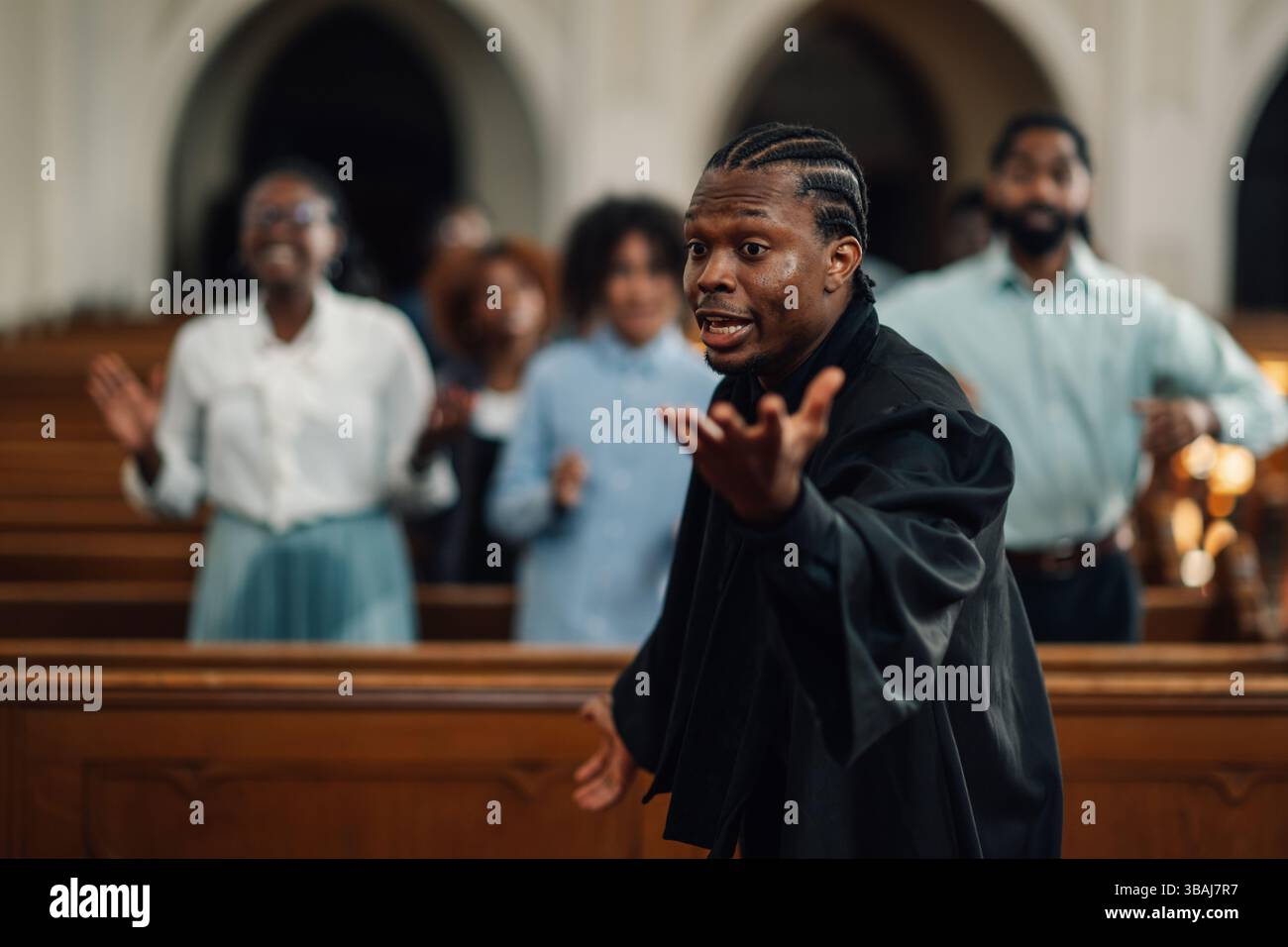 Pastor is leading a church service, preaching a sermon and gesturing ...