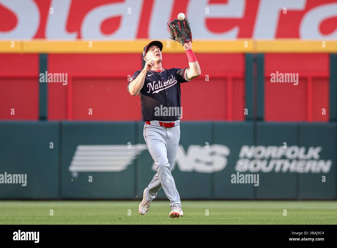 Washington Nationals outfielder Jacob Young catches a ball in the first ...