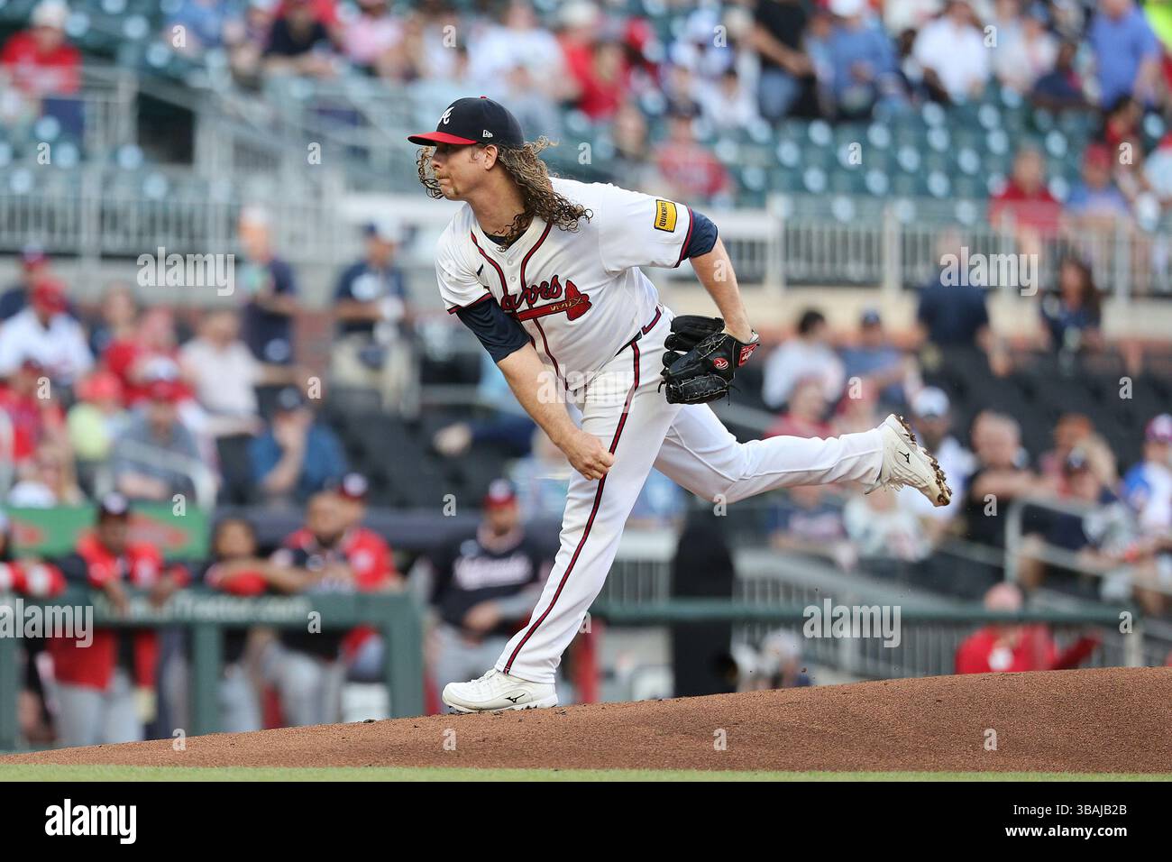 ATLANTA, GA - MAY 12: Grant Holmes (66) of the Atlanta Braves delivers ...
