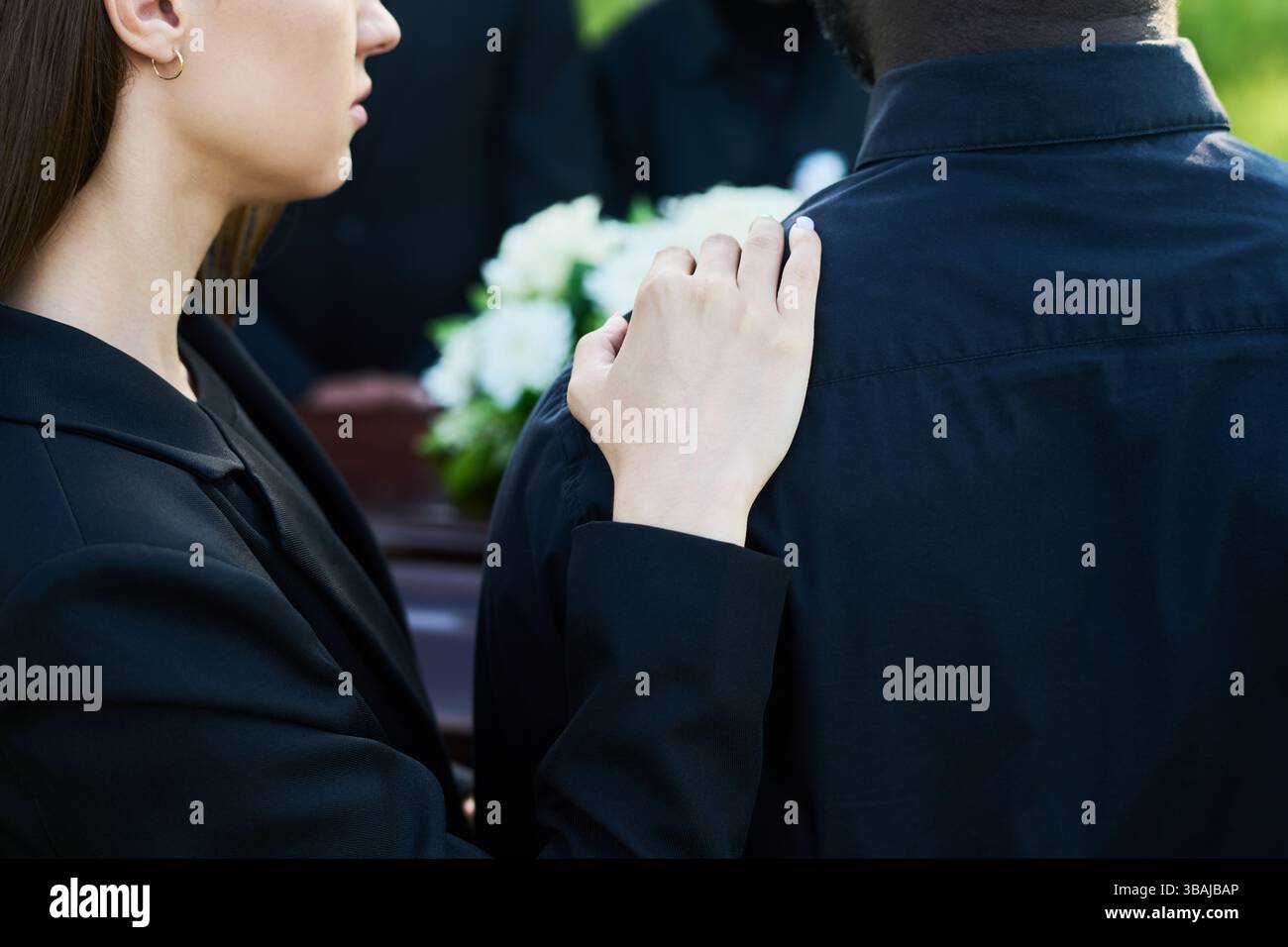 Close-up of young supporting woman consoling her grieving friend ...
