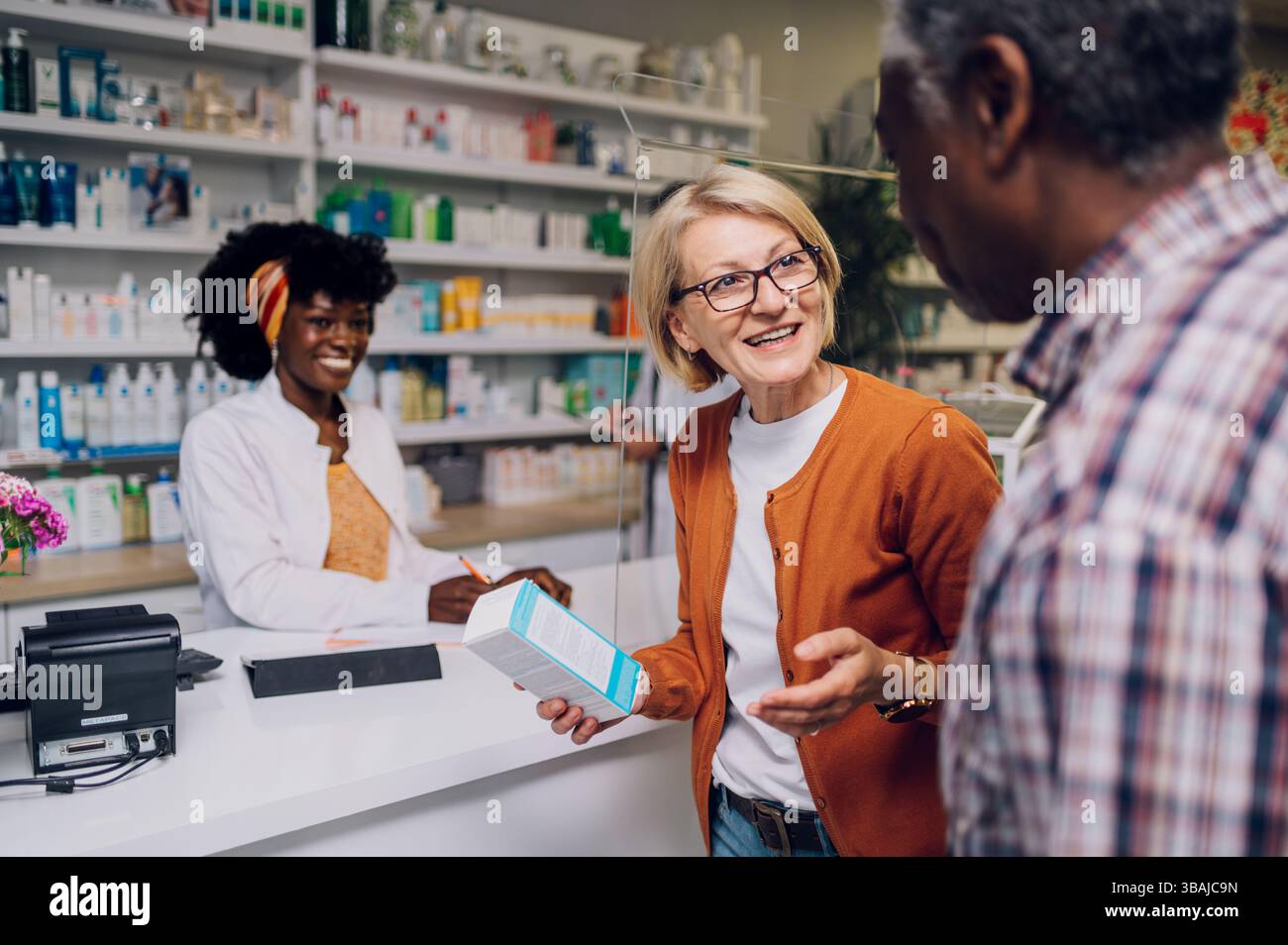 Portrait of a two diverse senior patients customers shopping at ...