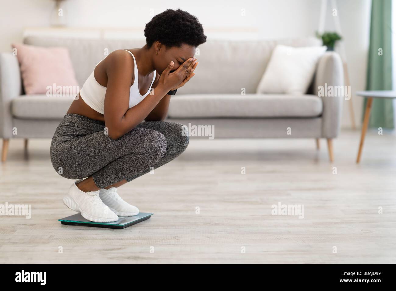 Weight Gain. Unhappy African American Woman Crying Standing On Weight ...