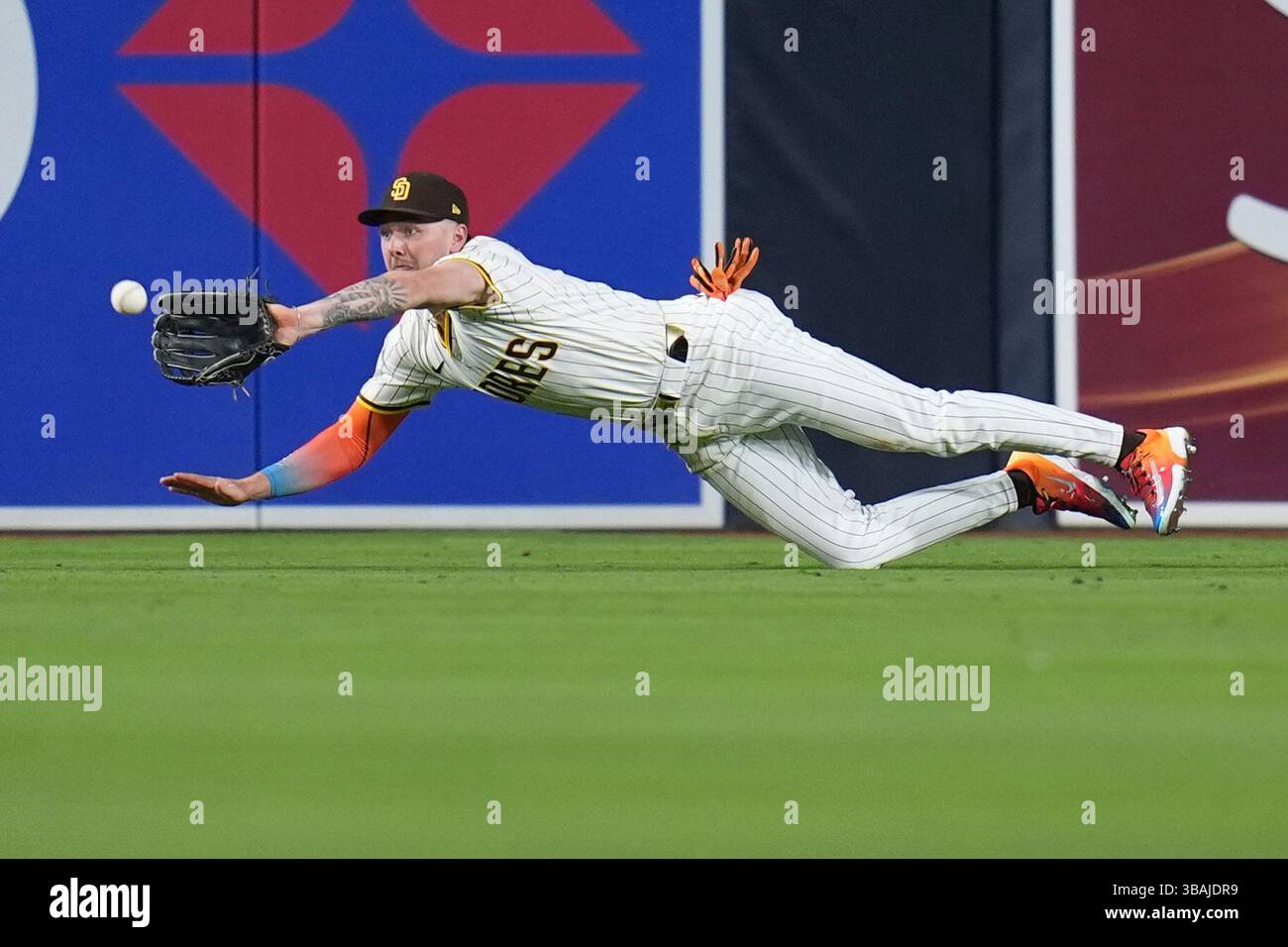 San Diego Padres center fielder Jackson Merrill makes the catch for the ...