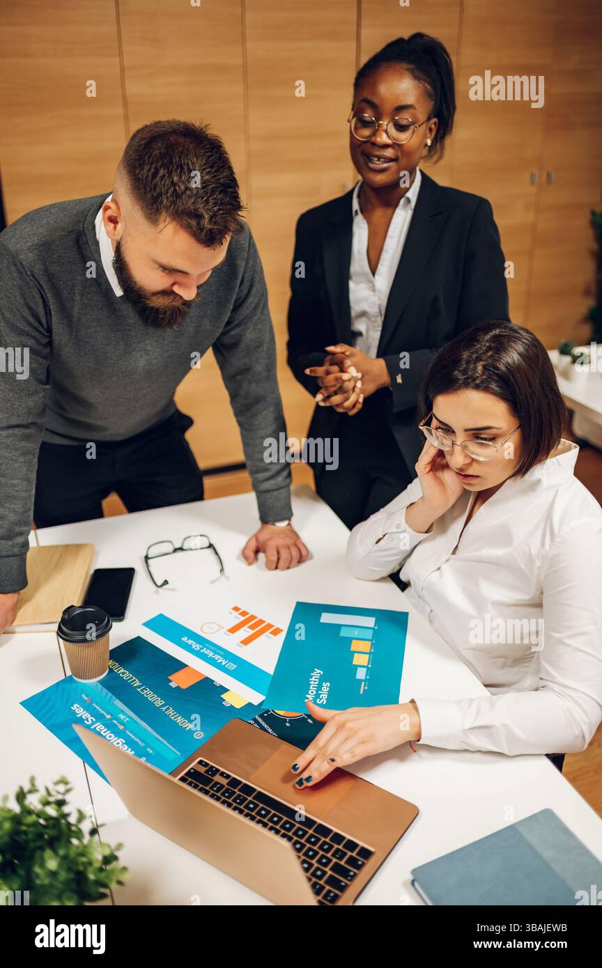 Two business people are discussing about business graph in the office ...