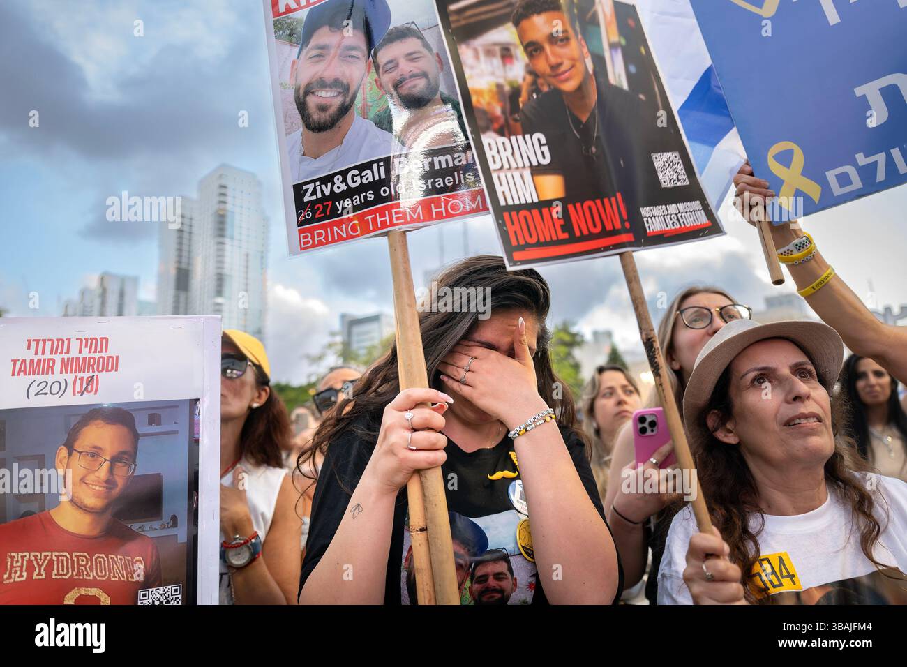Tel Aviv, Israel. 12th May, 2025. A woman cries as she sees hostage ...